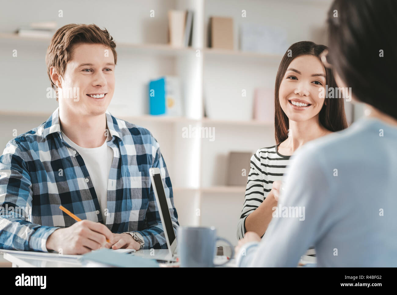 Beautiful colleagues. Handsome manager wearing nice striped shirt ...