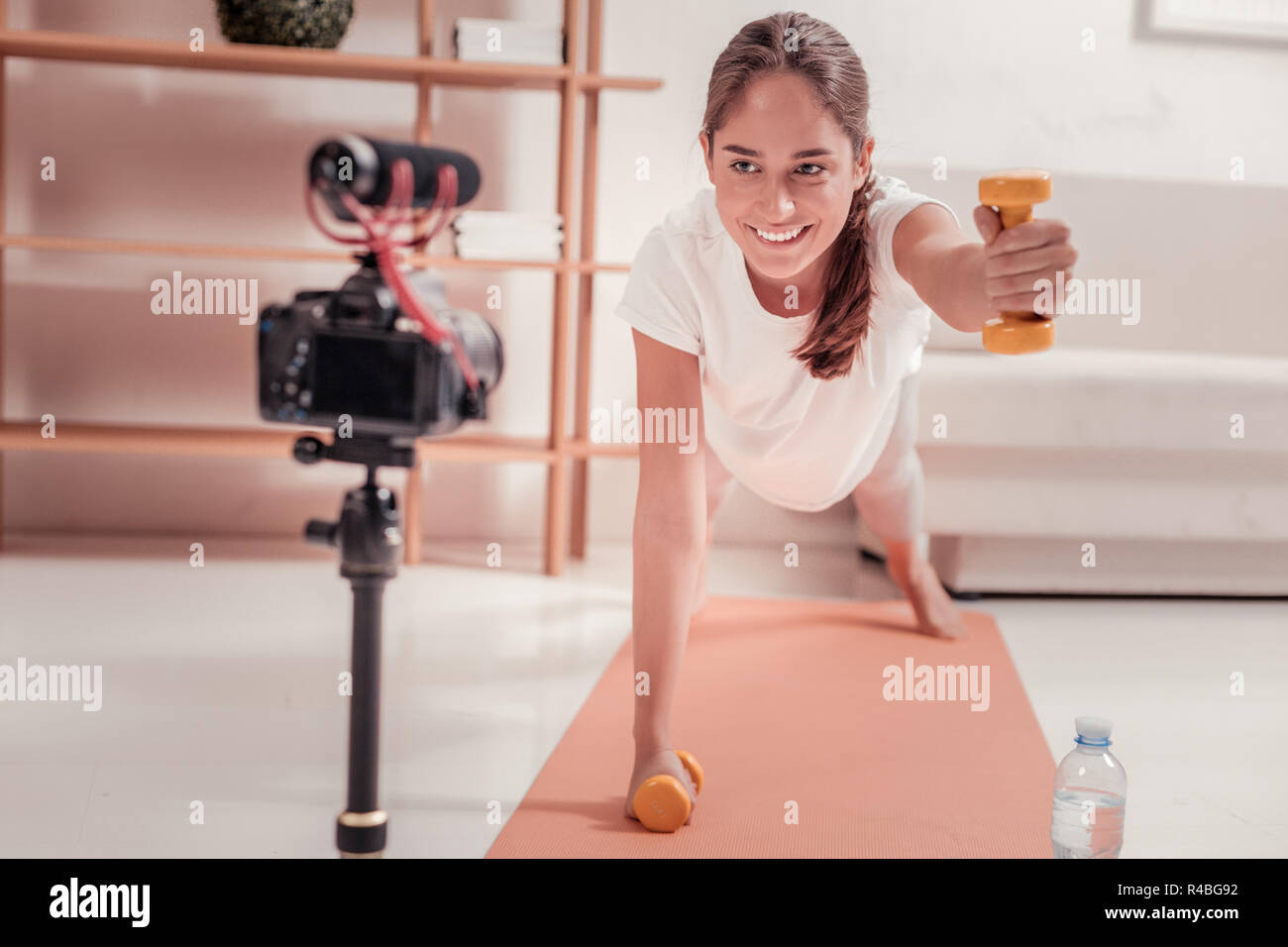 Difficult exercises. Inspired pretty lady training muscles while ...