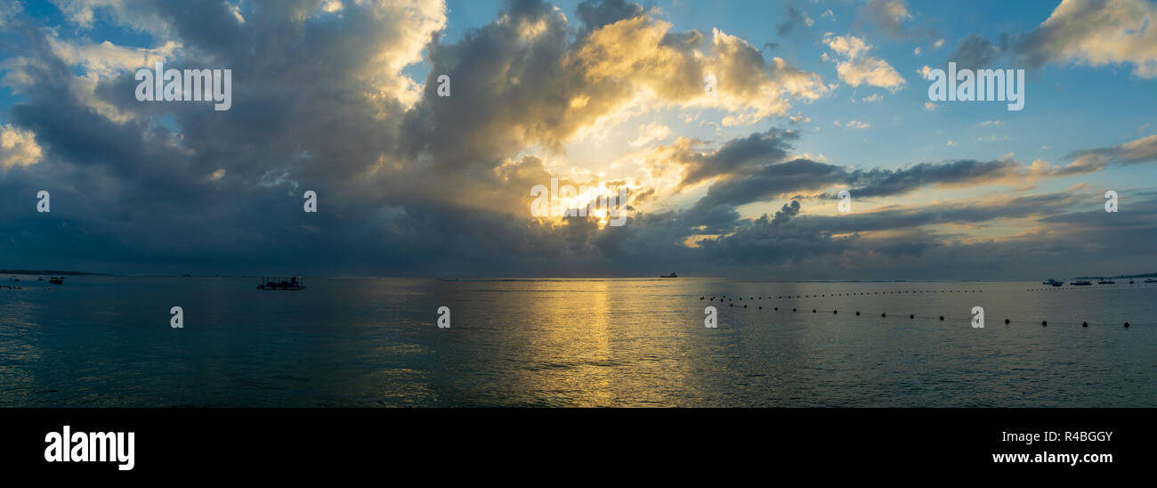A panoramic view of sunrise from the Nusa Dua, Bali, Indonesia- the ...
