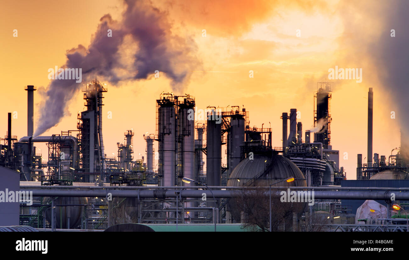 Smokestack in factory with yellow sky and clouds Stock Photo - Alamy