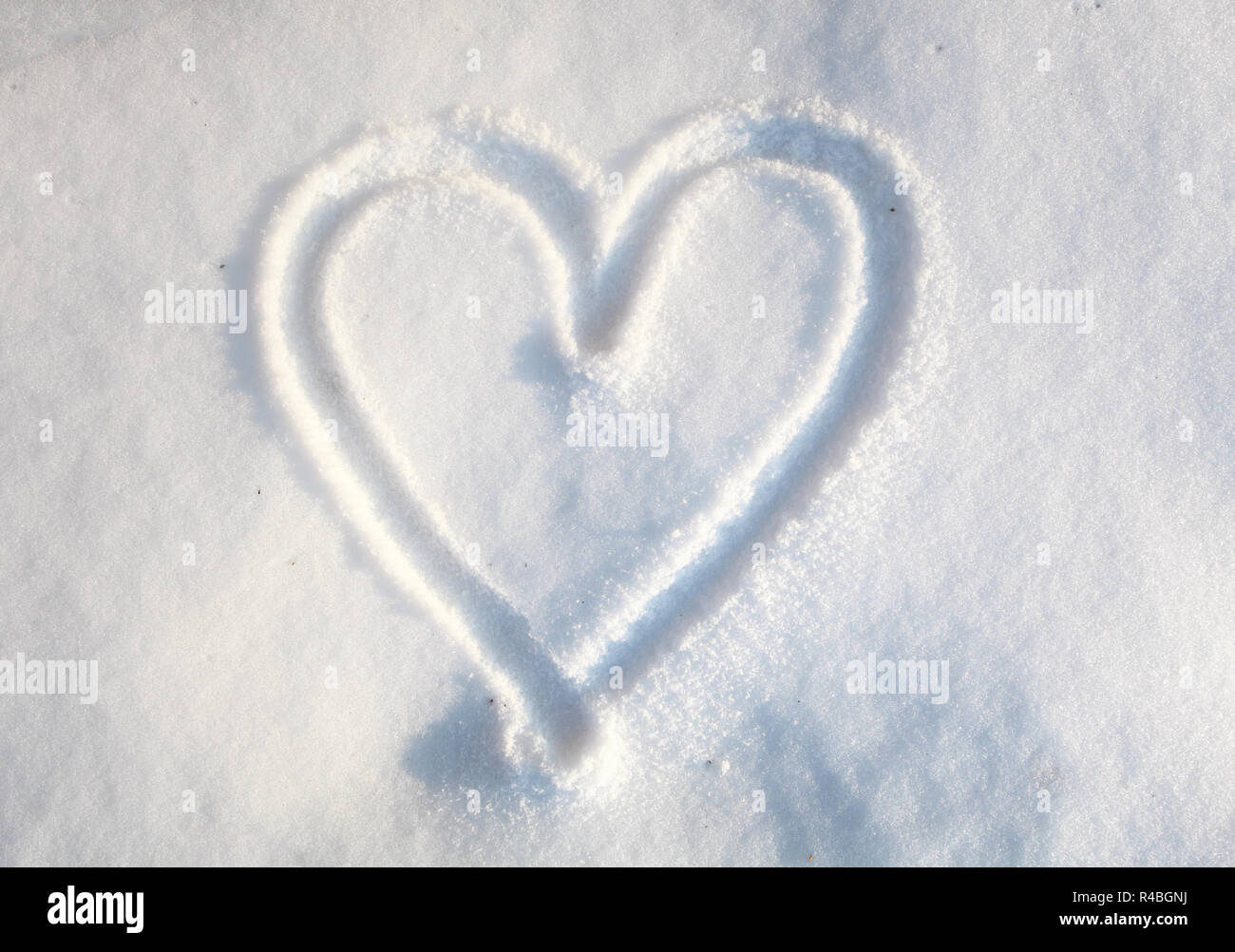 heart in snow Stock Photo - Alamy