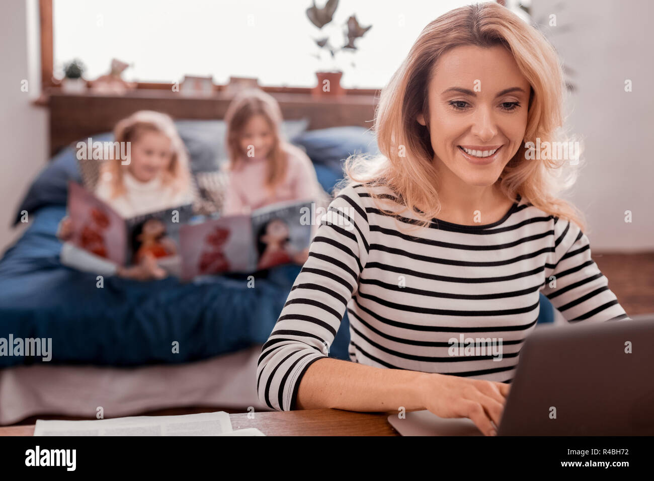 Remote work. Smart beautiful lady working on the laptop while being at ...