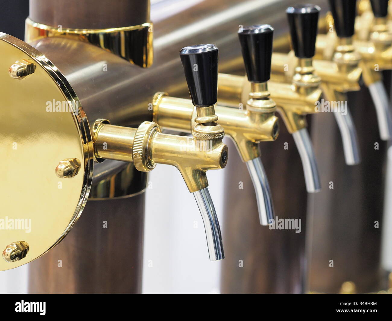 Row of polished beer taps Stock Photo - Alamy