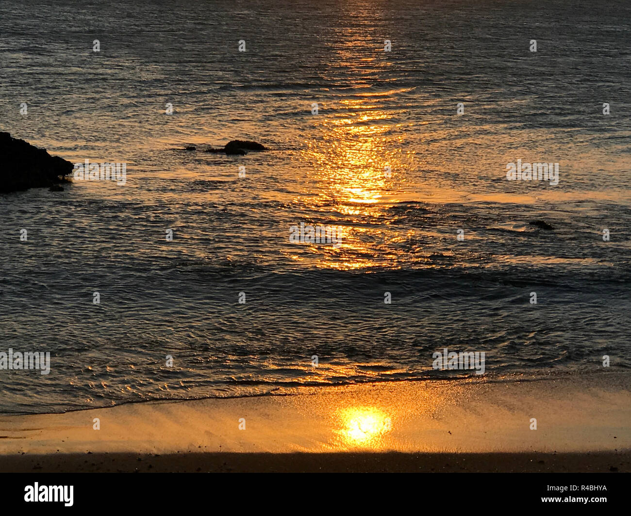 Reflections on the beach Stock Photo - Alamy