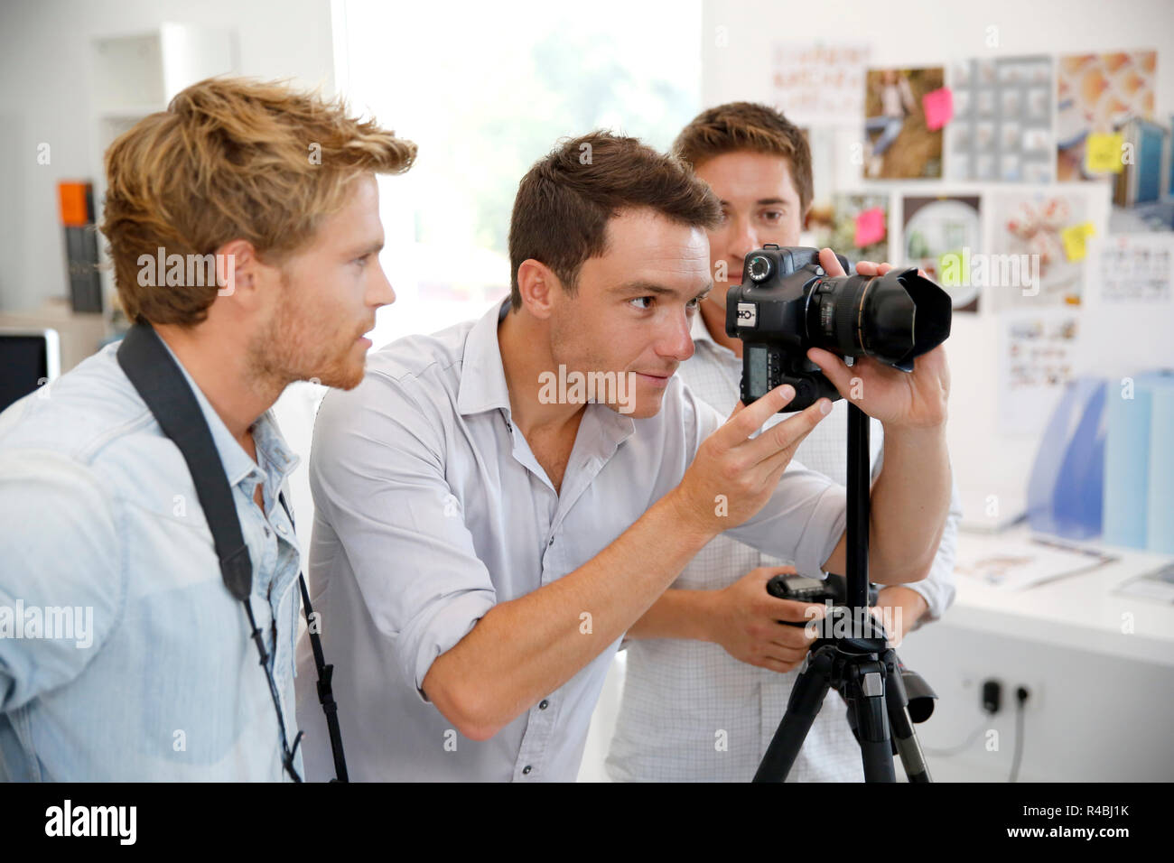 Photographer with students in training class Stock Photo - Alamy
