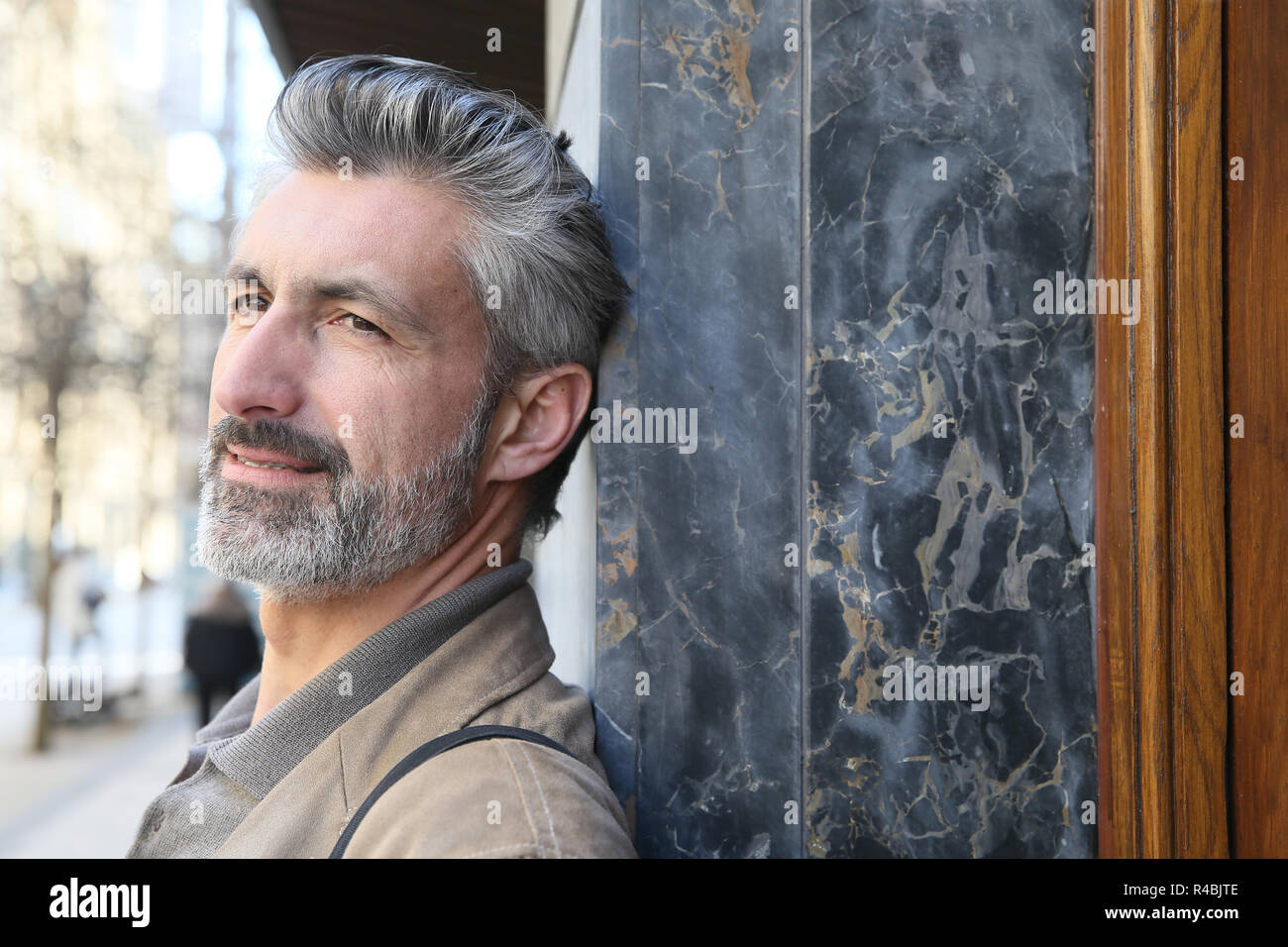 Man beard smiles leaning hi-res stock photography and images - Alamy