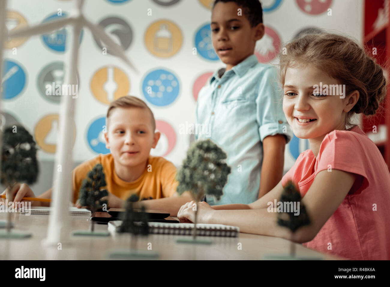 Pleasant smile. Kind pupils expressing positivity while studying ...
