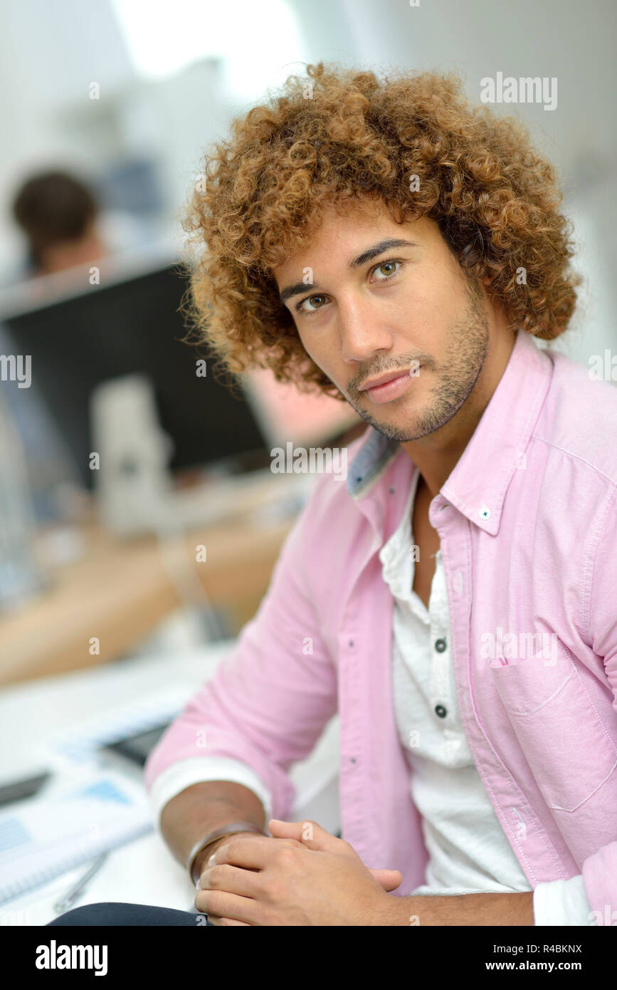 Young man in office working on desktop computer Stock Photo - Alamy