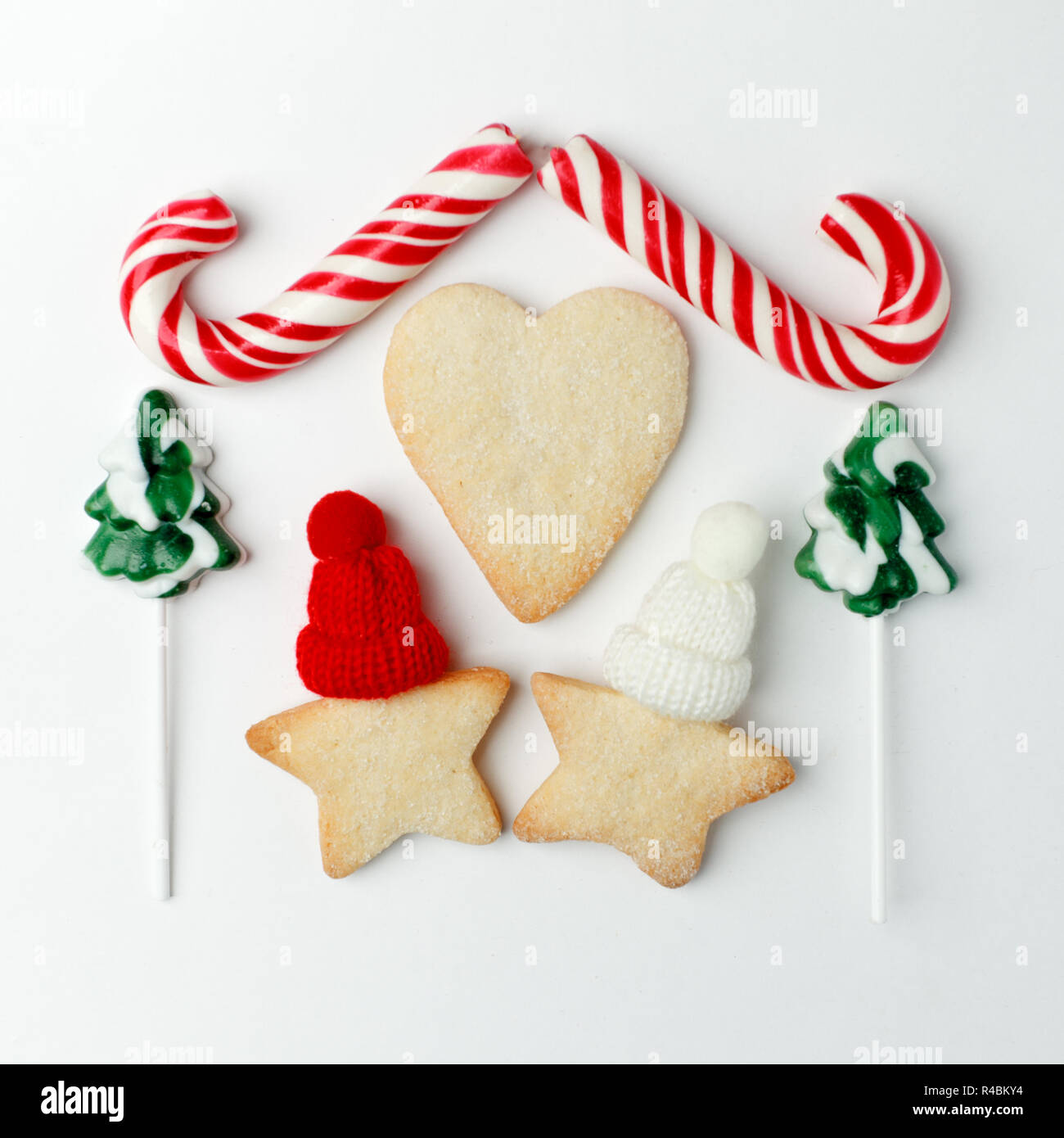 Christmas objects laid out in the shape of a Christmas house home ...