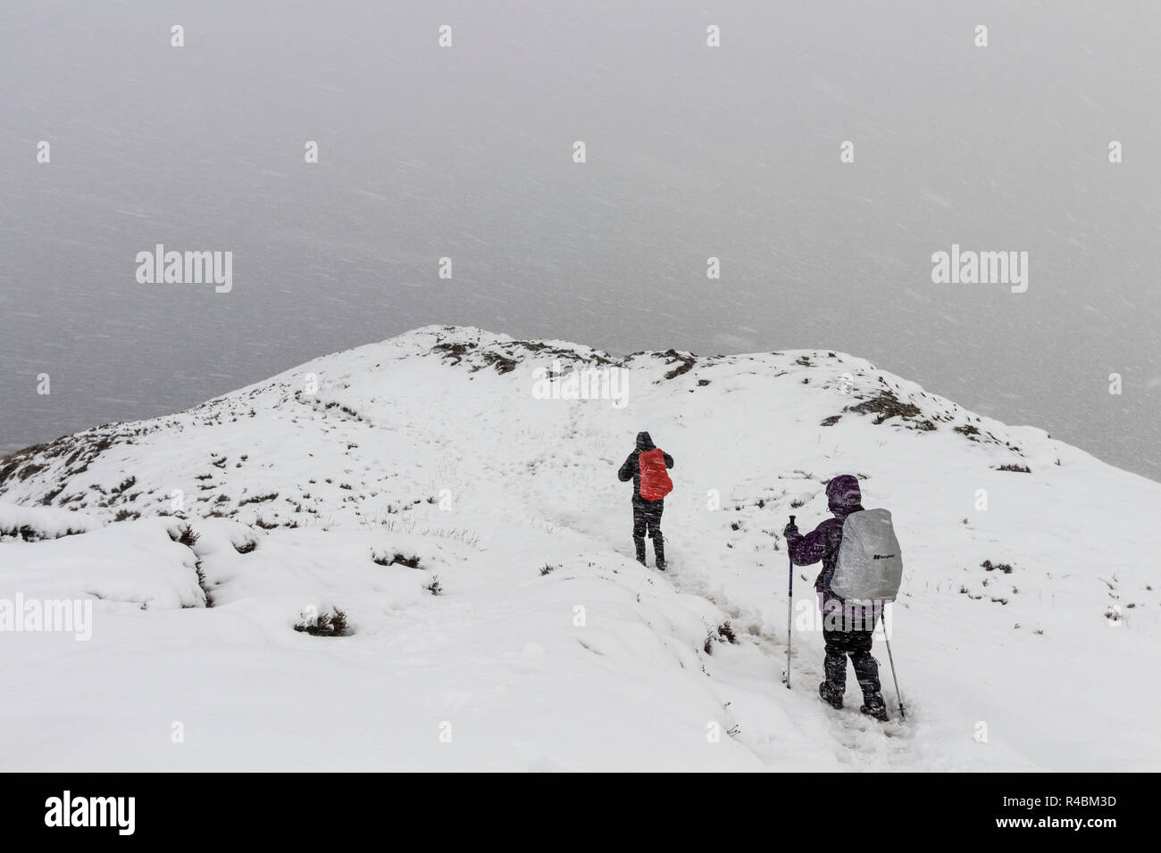 Two People Walking in Driving Snow on the Mountain of Barrow, Lake ...
