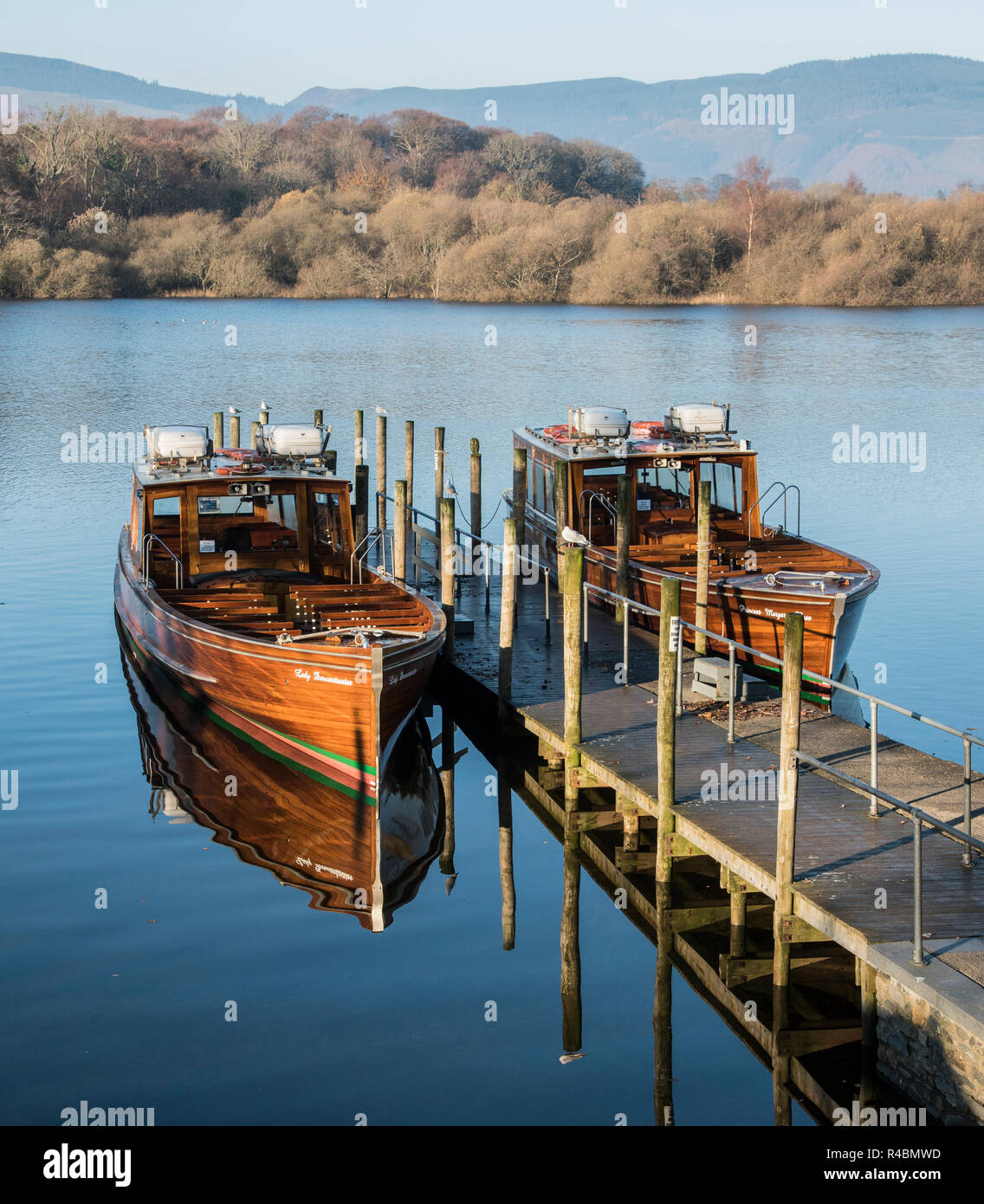 Tourist boats moored up a long the jetty on Derwentwater Lake in the ...