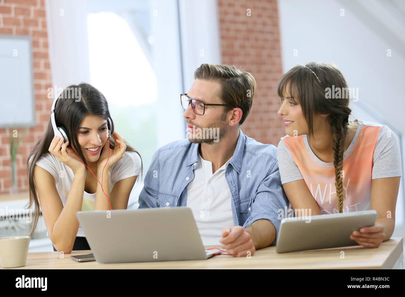 Group of friends connected together on laptop and tablet Stock Photo ...