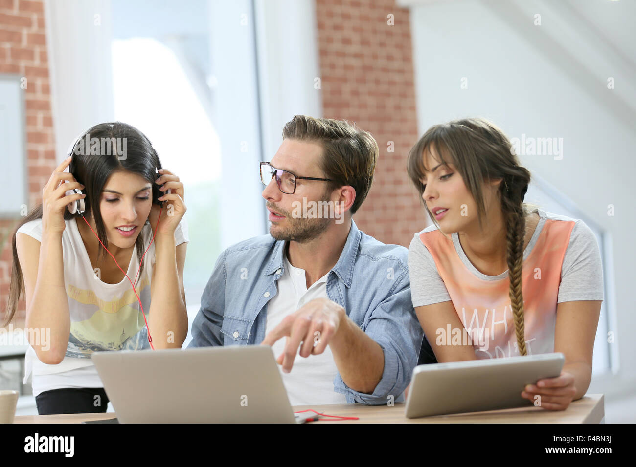 Group of friends connected together on laptop and tablet Stock Photo ...