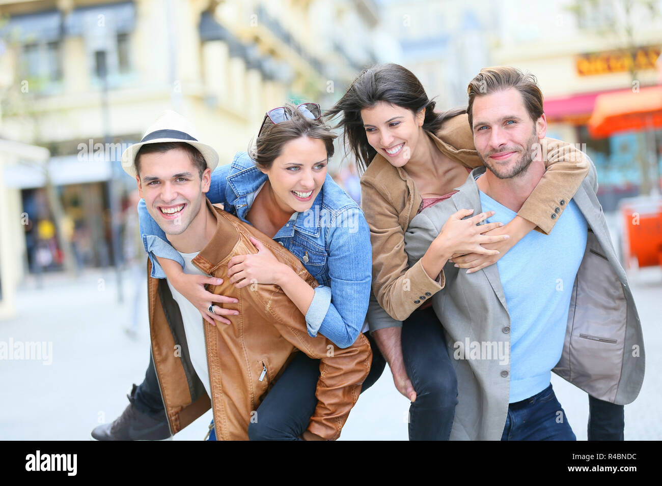 Group of friends getting silly in shopping street Stock Photo - Alamy