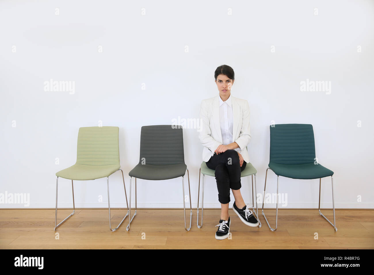 Job applicant sitting in waiting room, interview day Stock Photo - Alamy