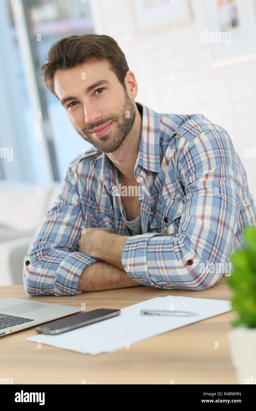 Portrait of smiling home-office worker Stock Photo - Alamy