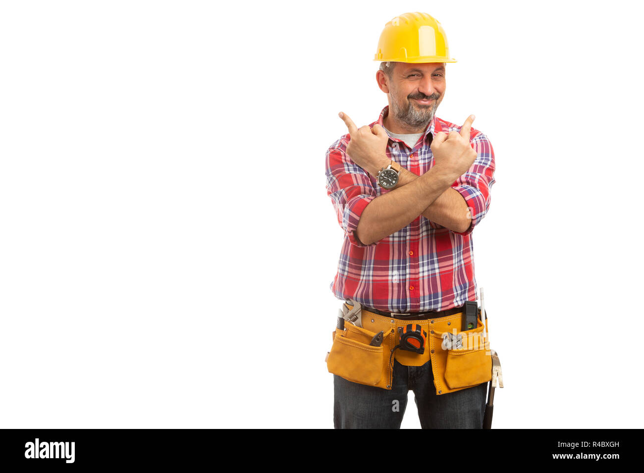 Builder holding arms crossed with middle fingers up with joking ...