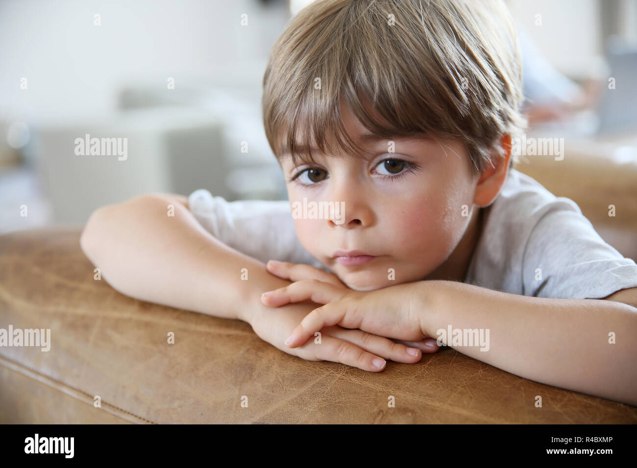 Portrait of cute little boy being thoughtful Stock Photo - Alamy