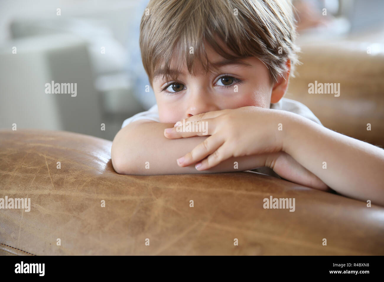 Portrait of cute little boy being thoughtful Stock Photo - Alamy