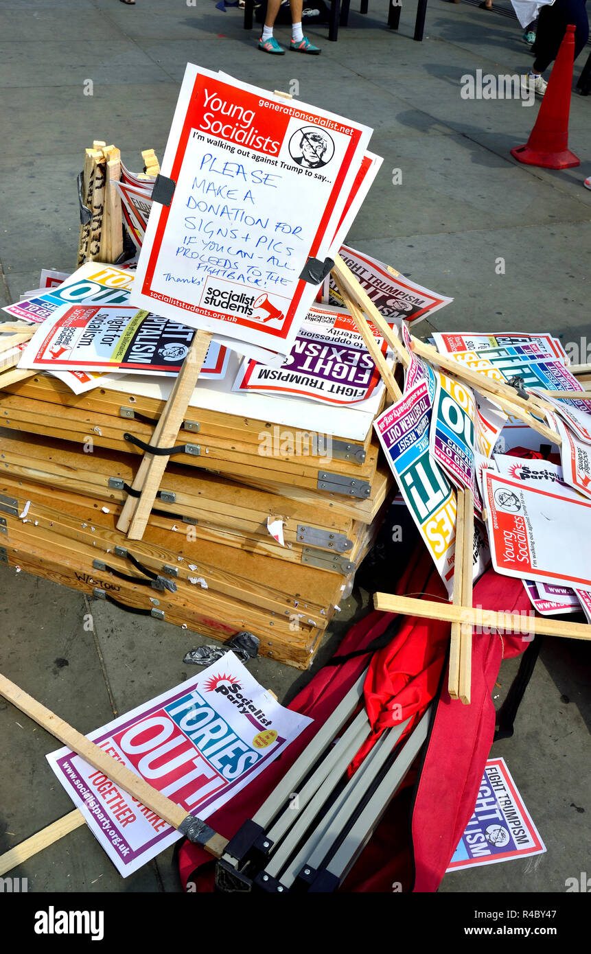 Pile of placards available at a protest march in central London ...