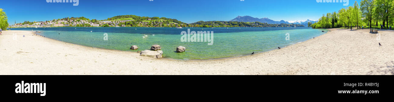 Sandy beach near Historic city center of Lucerne with famous Chapel ...