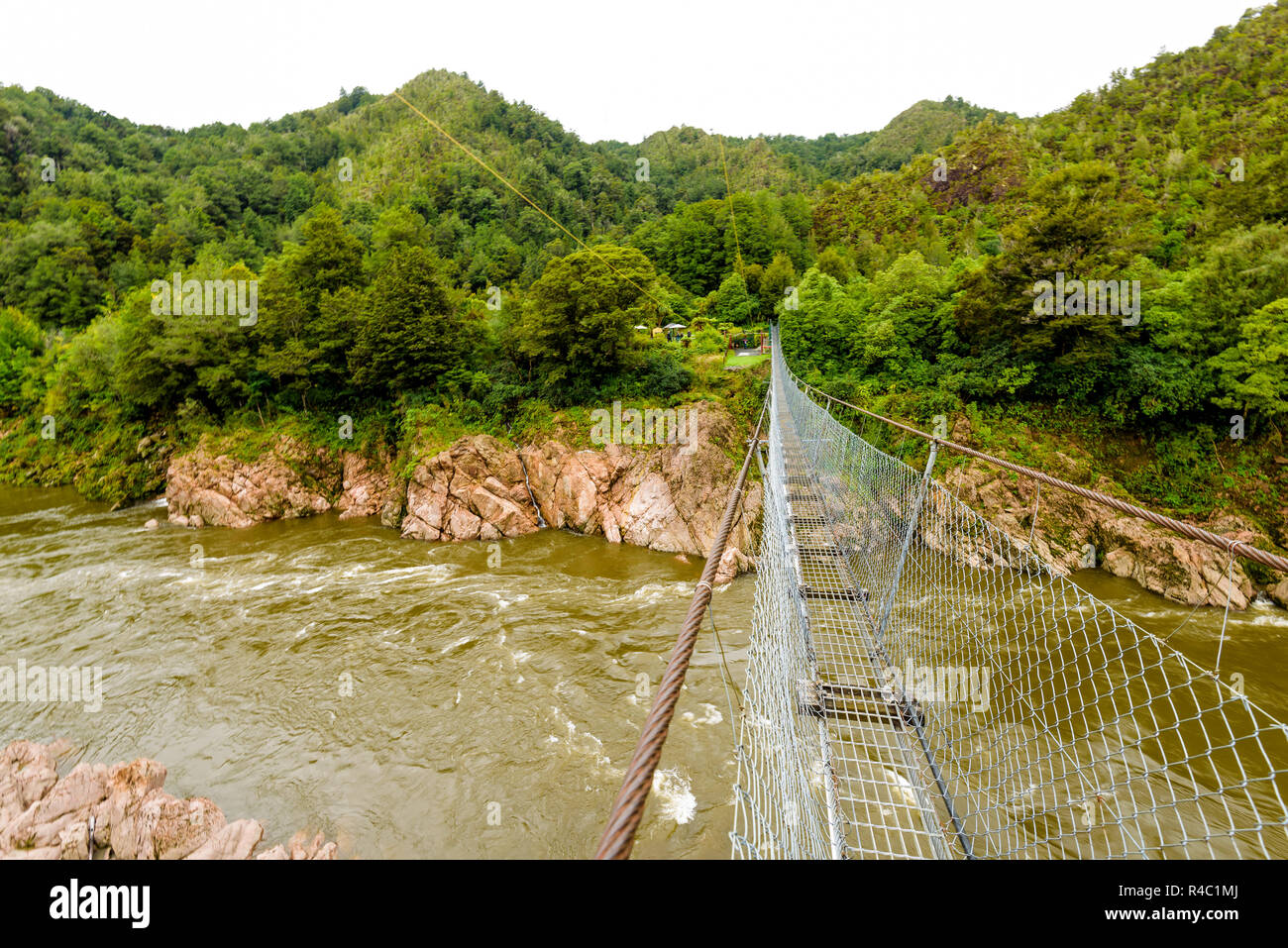 Buller Gorge Swing Bridge over Buller river, West Coast, South Island ...