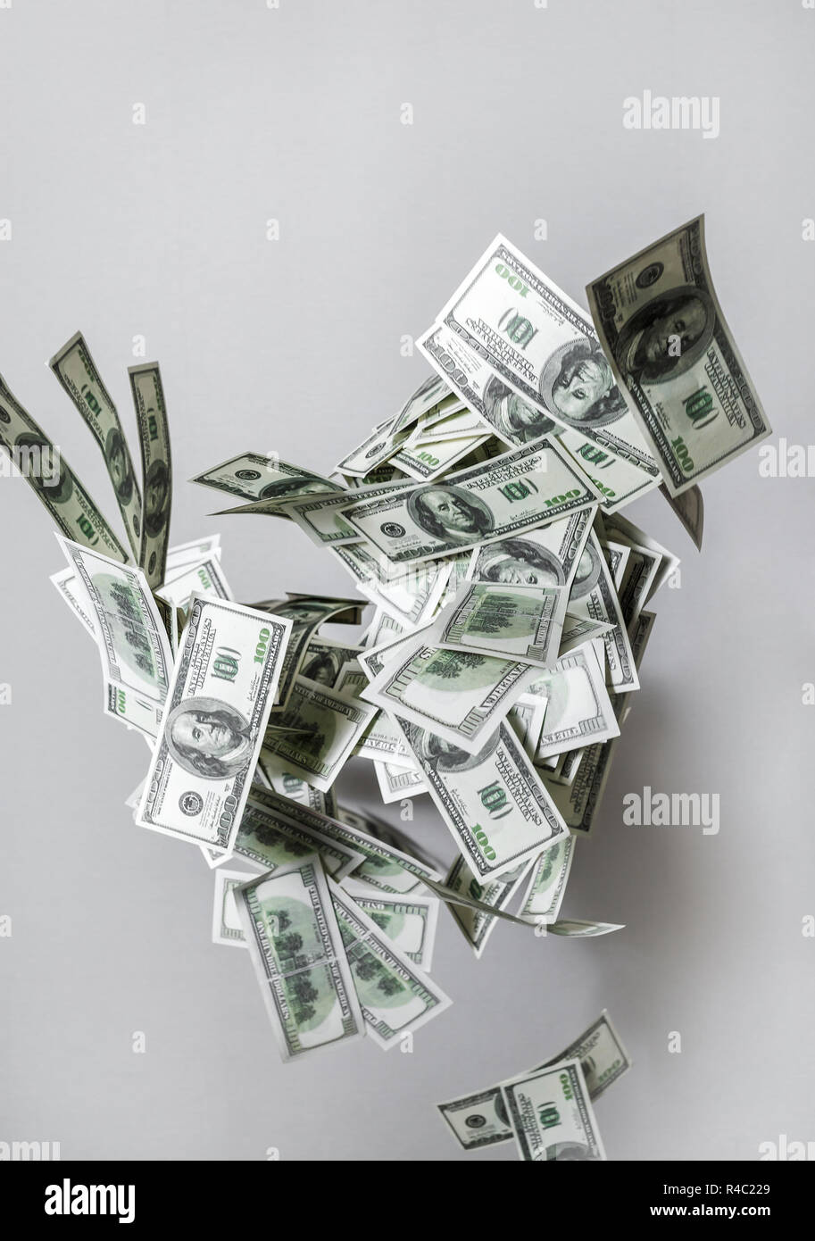 100 dollars falling hi-res stock photography and images - Alamy