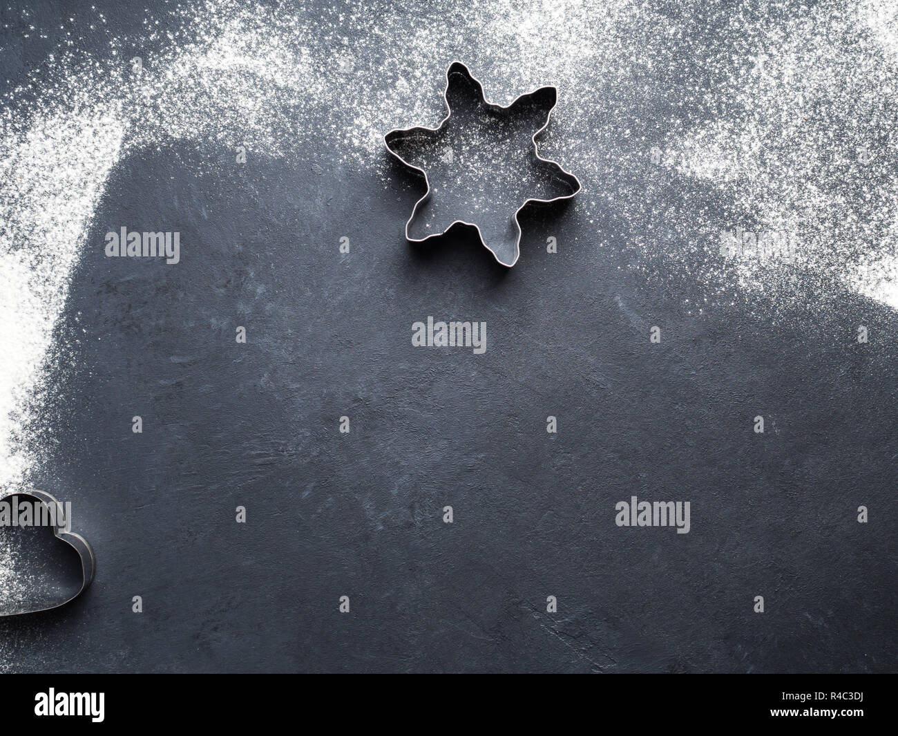 Baking accessories on black background with flour. Christmas winter ...