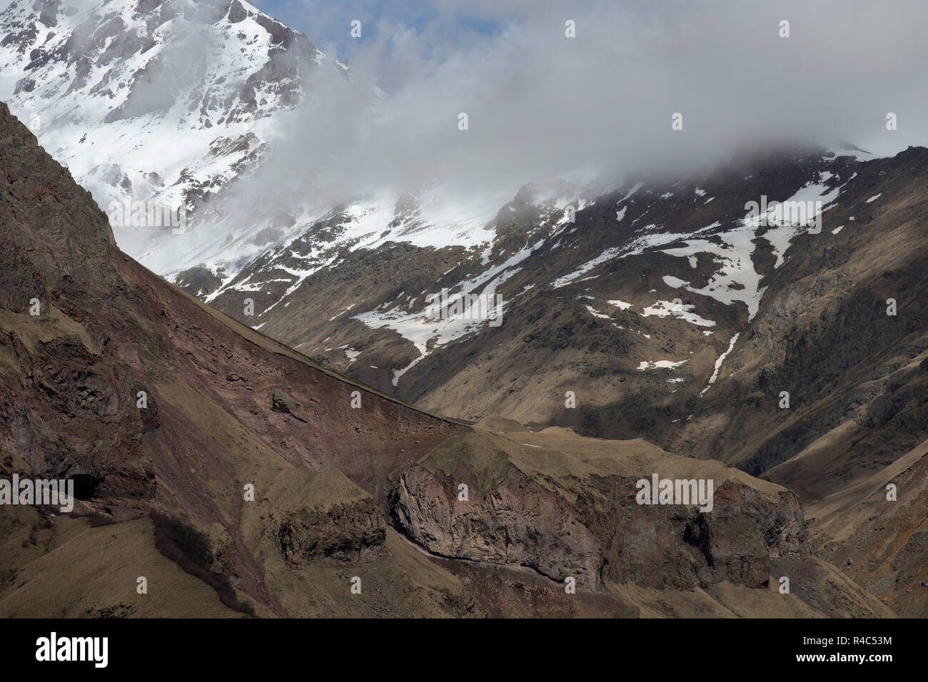 Clouds Flying Between Mountains Stock Photo - Alamy