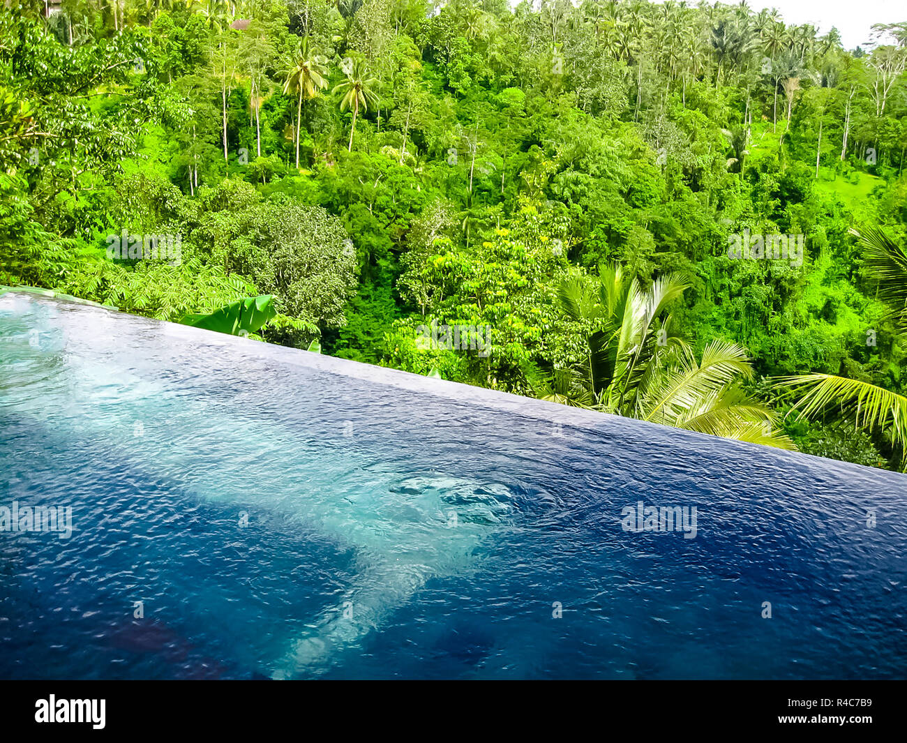 Bali, Indonesia - April 13, 2014: View of swimming pool at Ubud Hanging ...