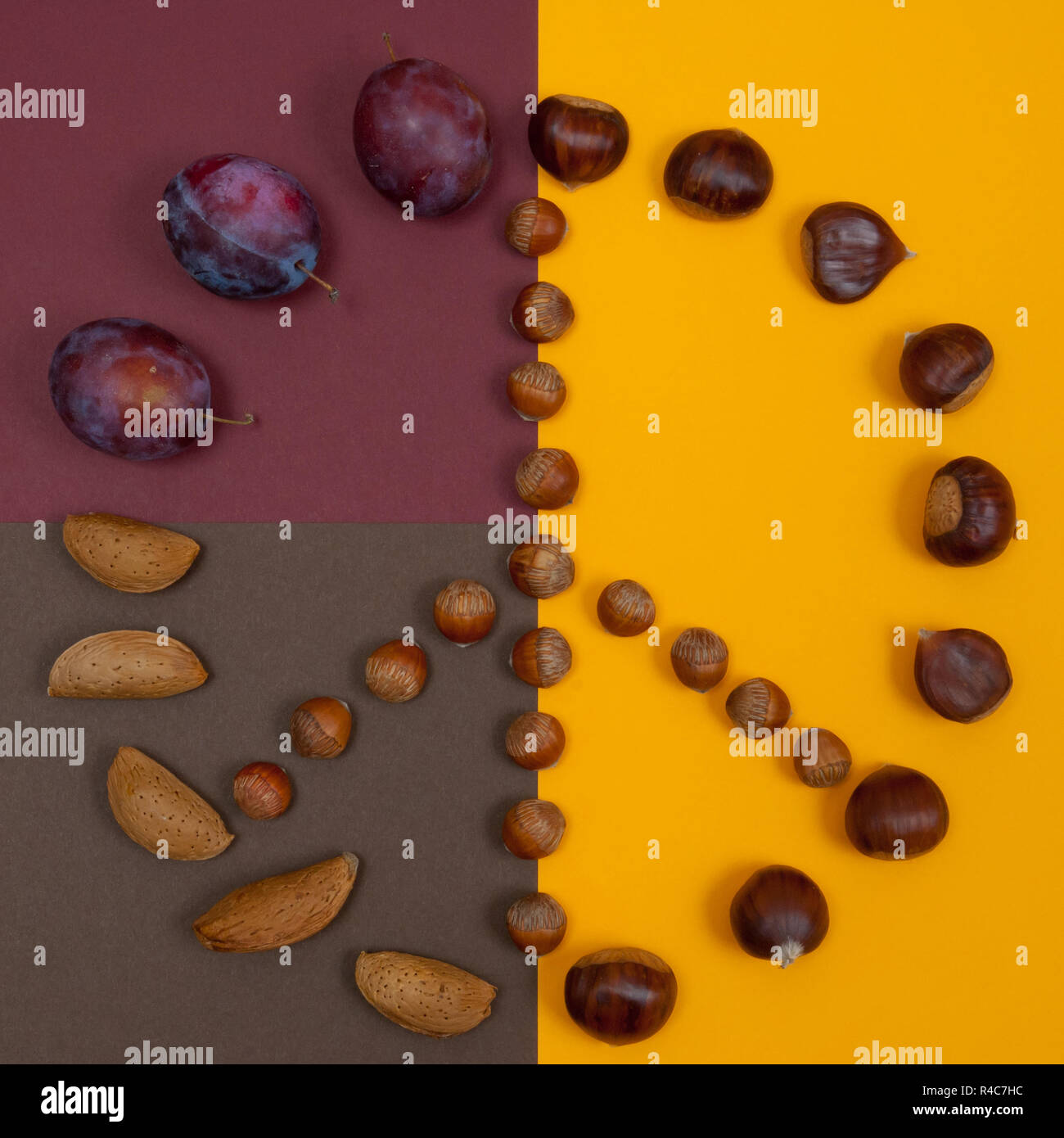 Peace symbol of nuts and autumn fruits on split background Stock Photo ...