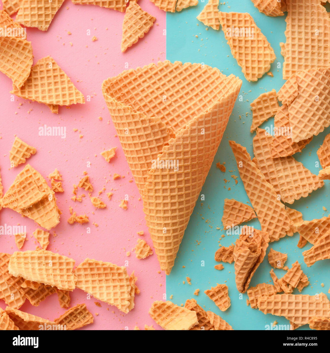 Ice Cream Waffle Cones On Pastel Pink And Blue Background Top View