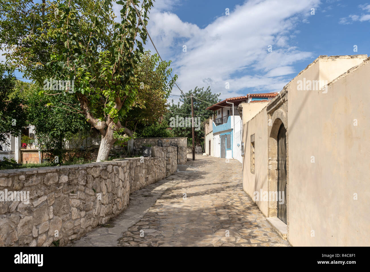 Way through a lonely mountain village on Crete Island, Greece with a ...