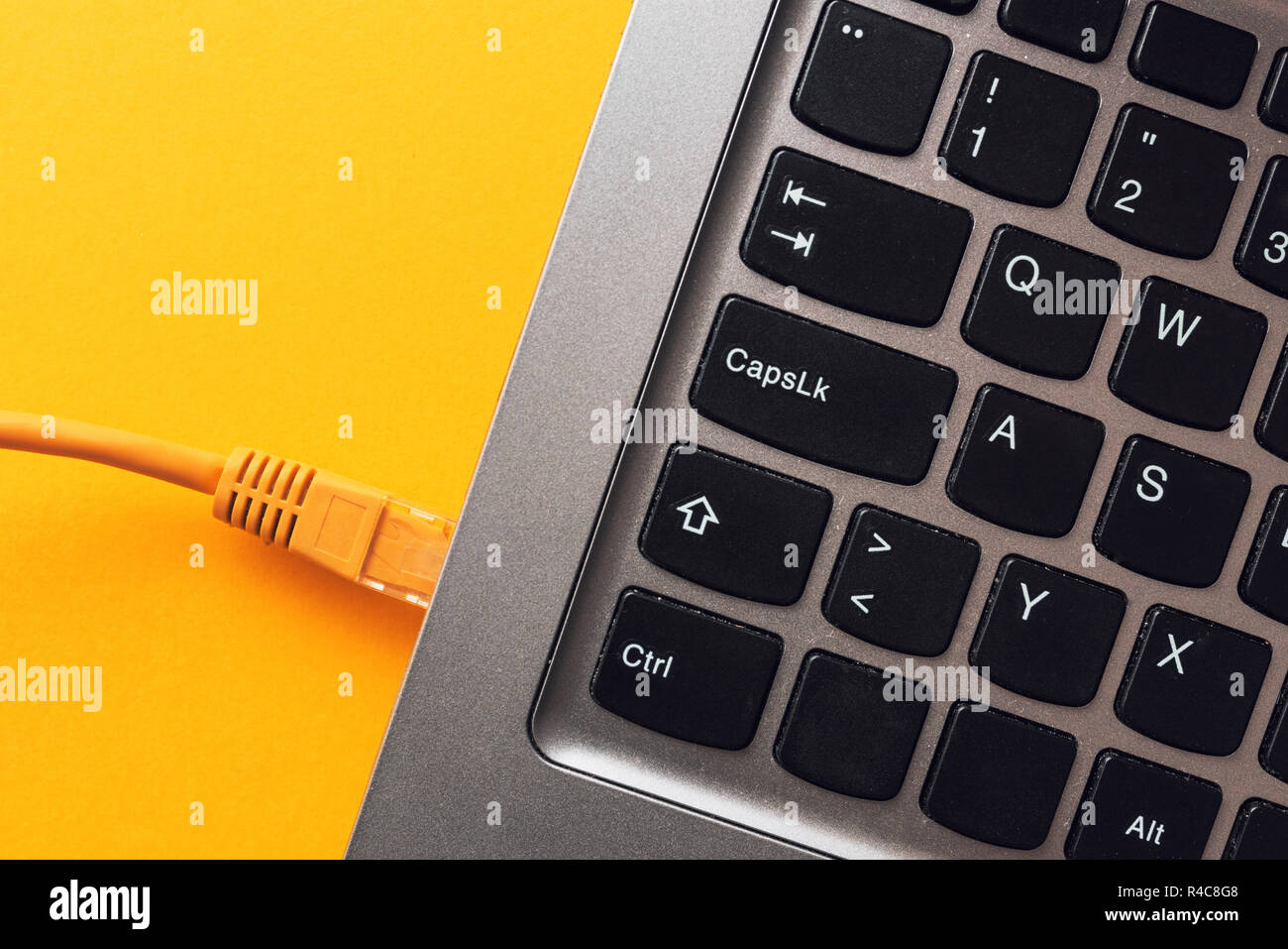Ethernet LAN cable plugged into laptop computer, top view Stock Photo ...