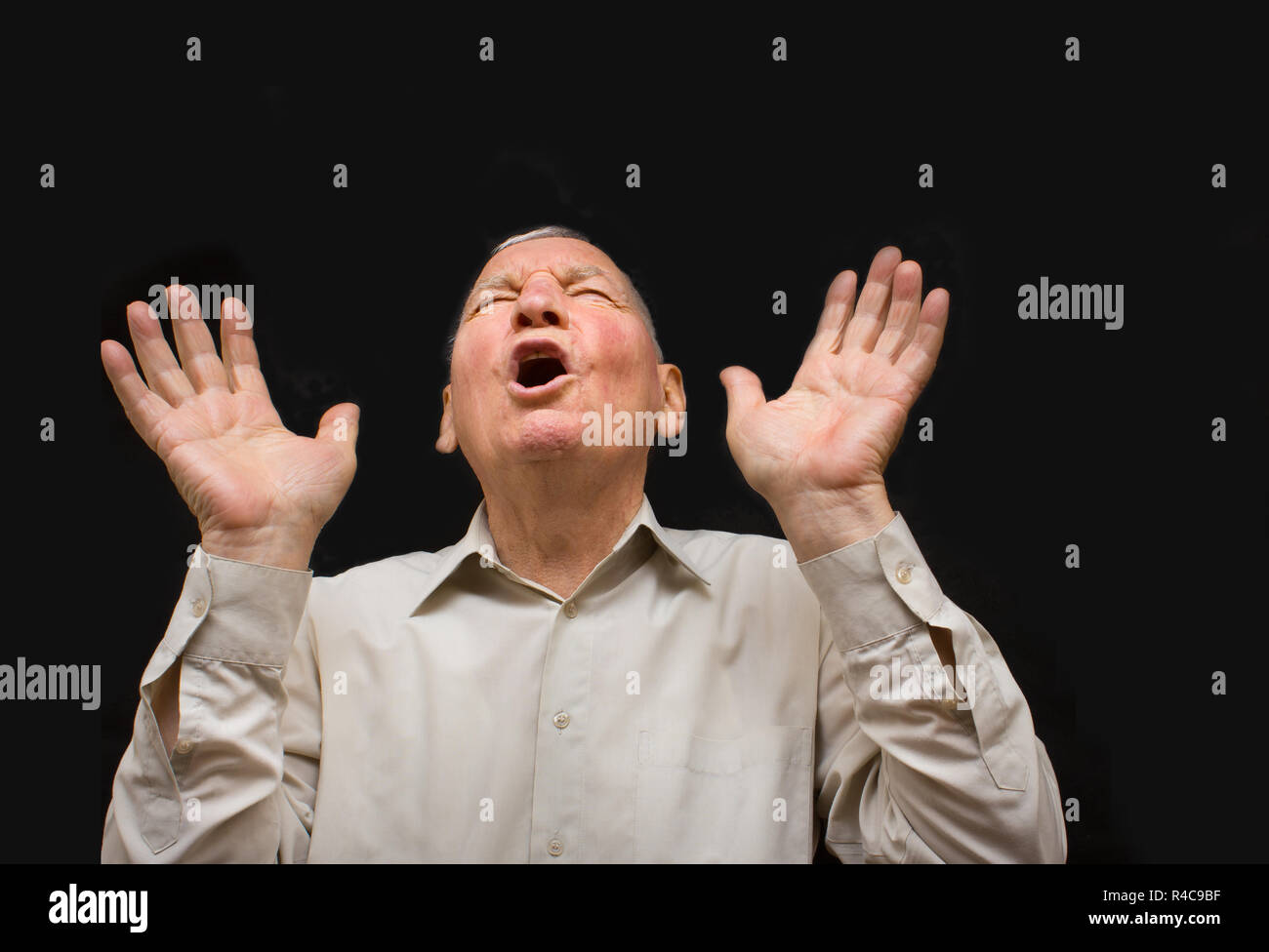 The old man with emotions on a dark background Stock Photo - Alamy