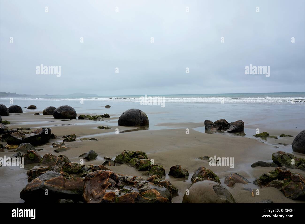 Boulders on the beach in New Zealand Stock Photo - Alamy