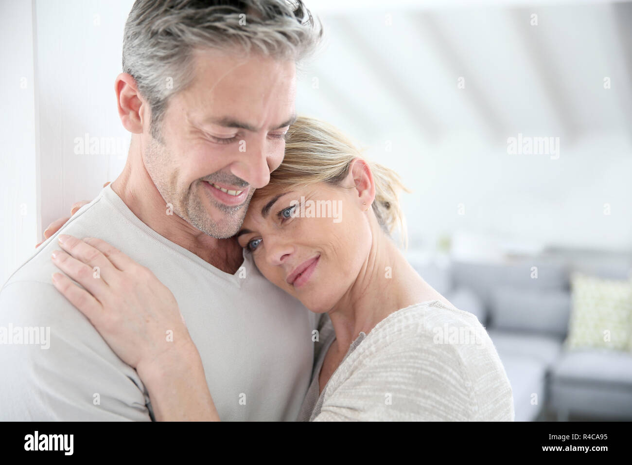 Mature couple embracing with love and tenderness Stock Photo - Alamy