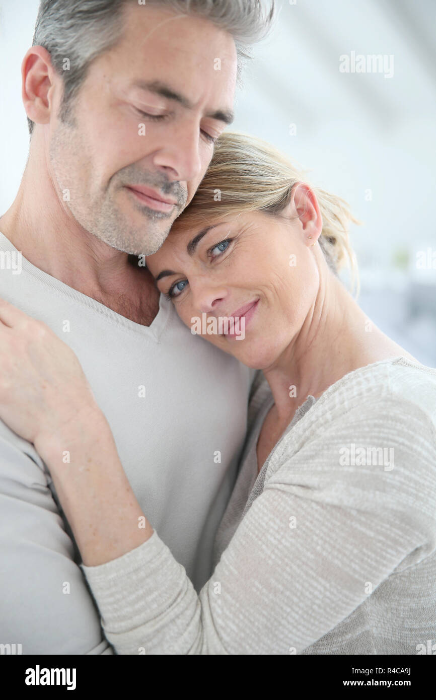 Mature couple embracing with love and tenderness Stock Photo - Alamy