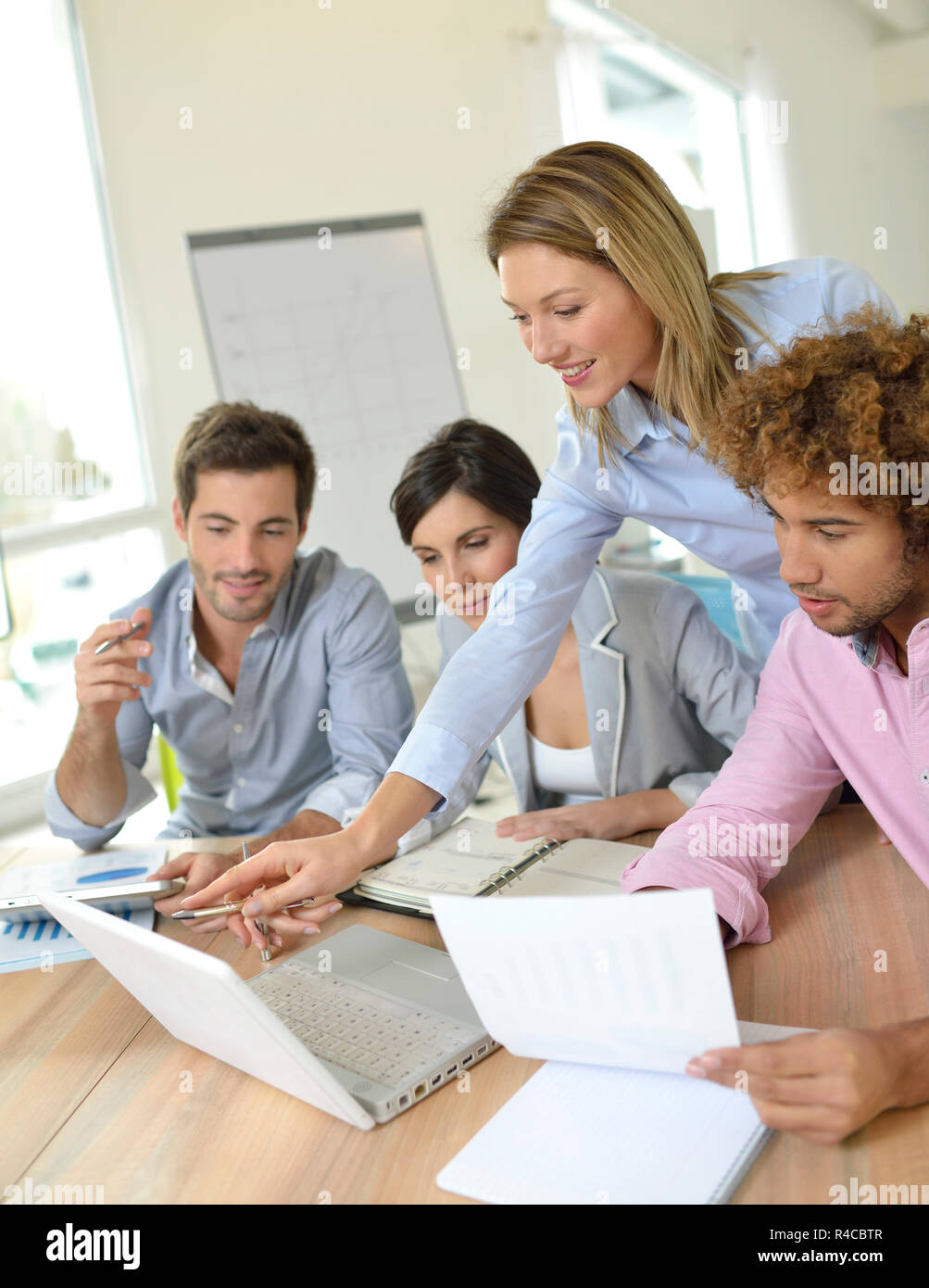 Woman manager with employees team Stock Photo - Alamy