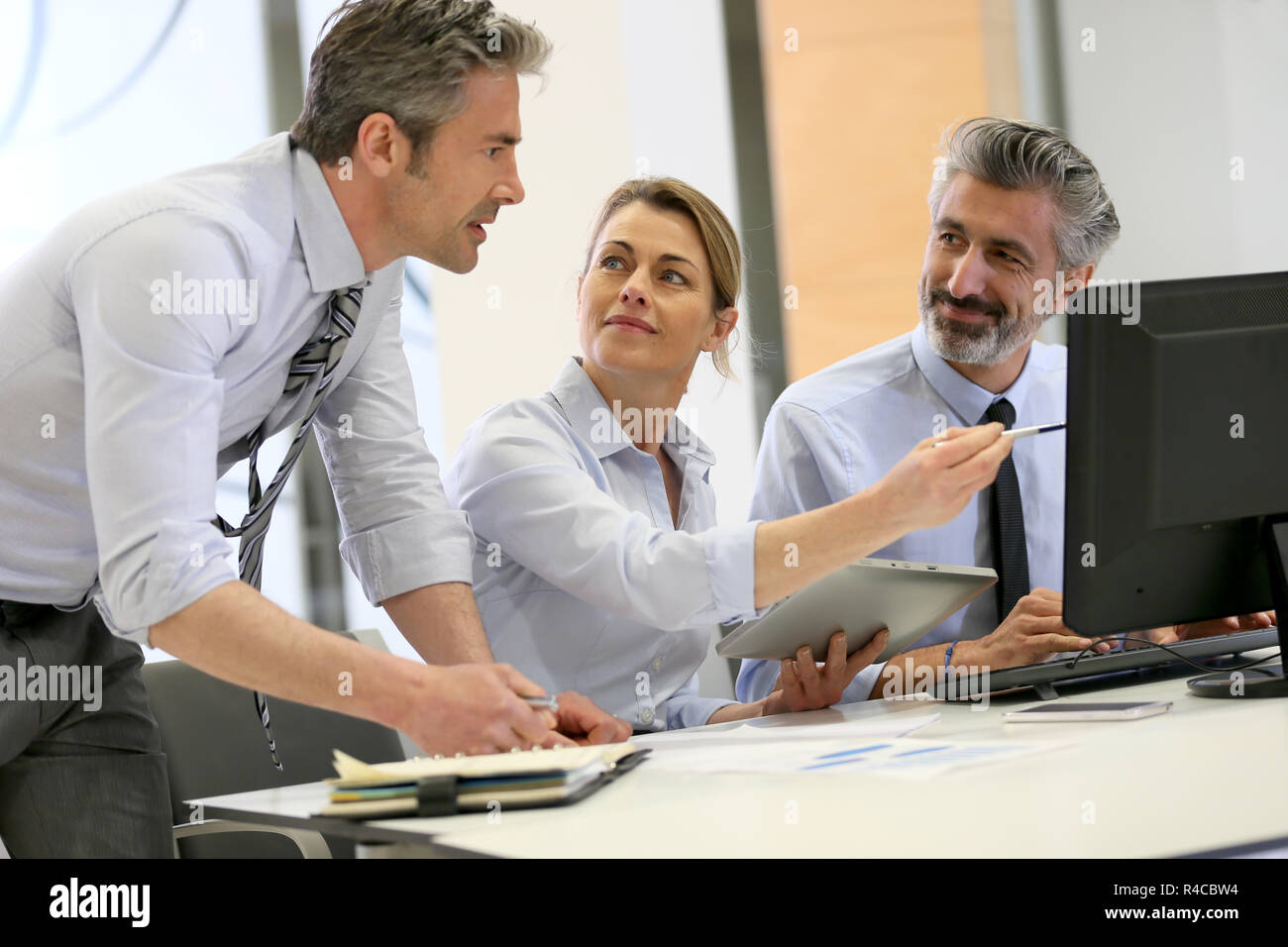 Business team working on project in office Stock Photo - Alamy