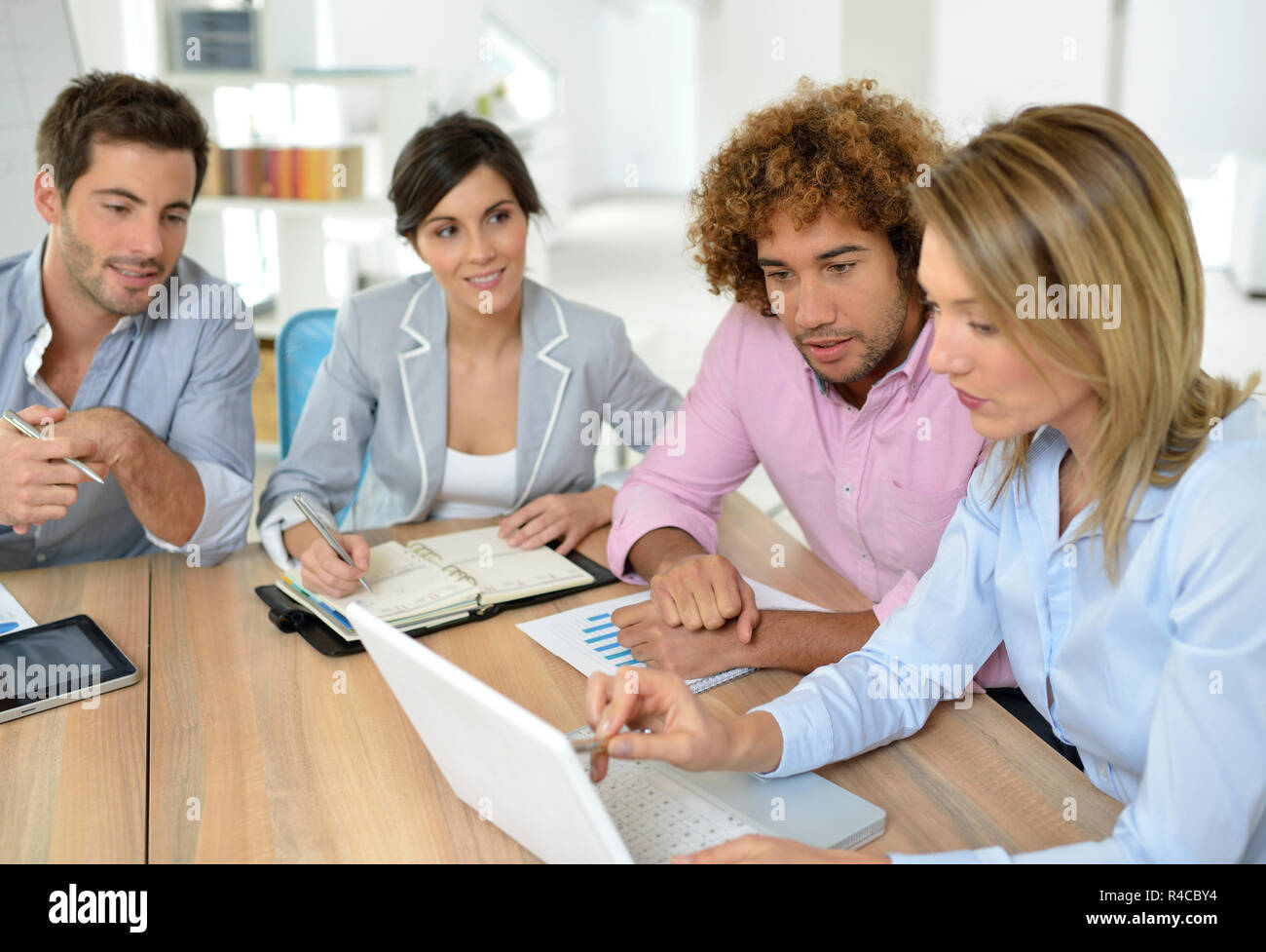 Business people meeting around table Stock Photo - Alamy