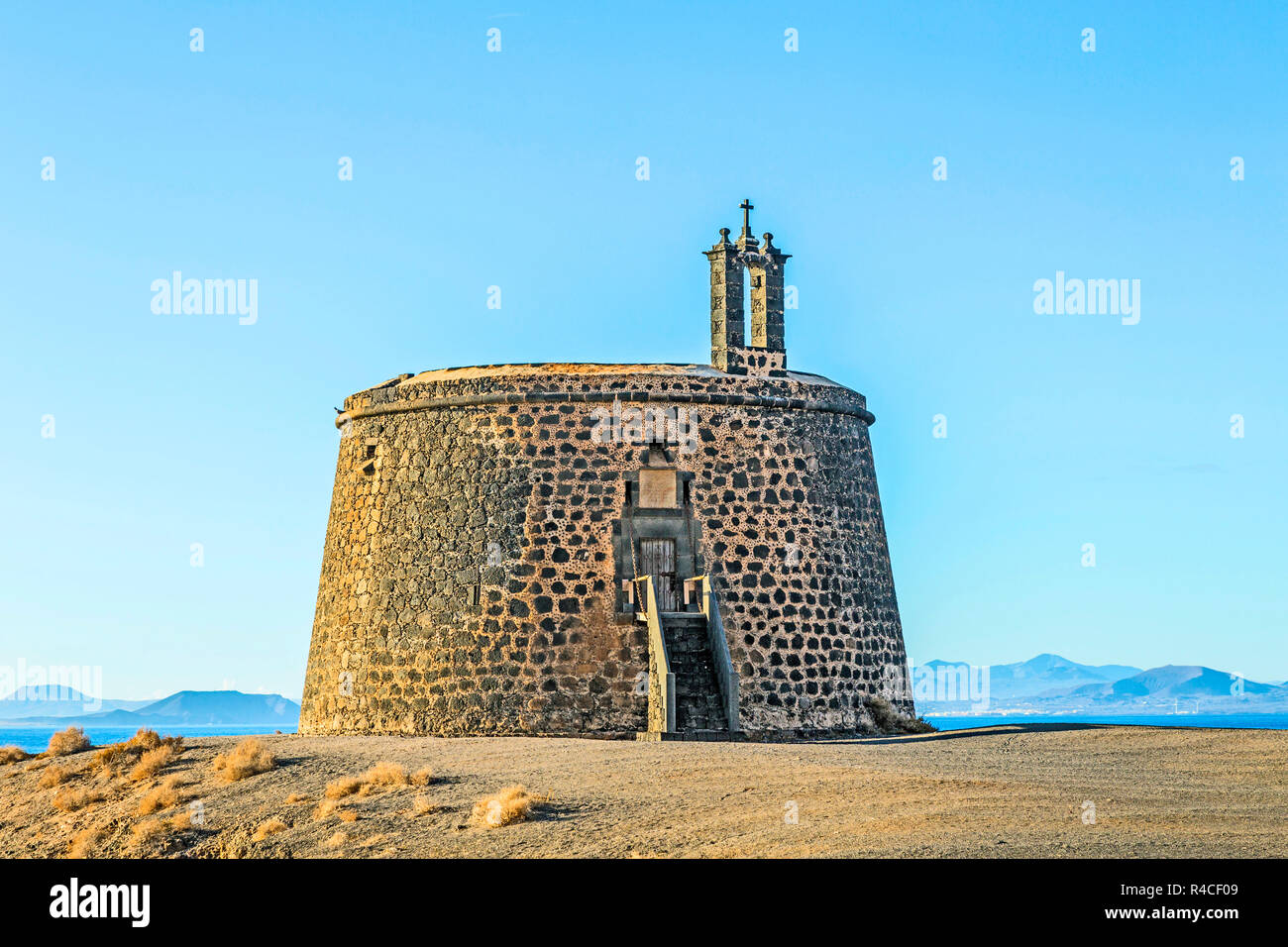 small castle castillo de las coloradas on cliff in playa blanca Stock ...