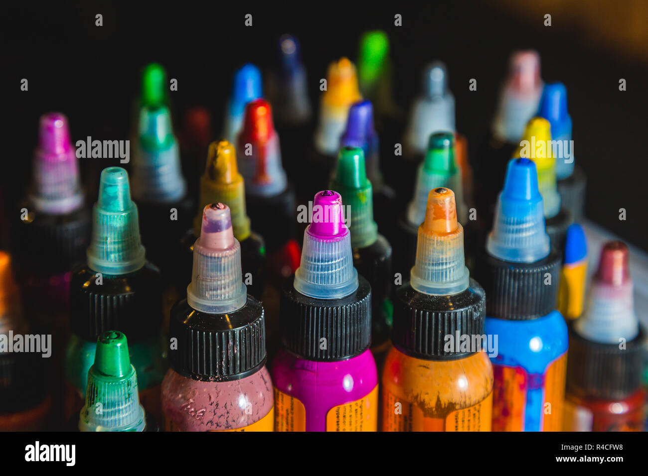 many professional bottles with colored ink for tattoos. tattoo parlor ...