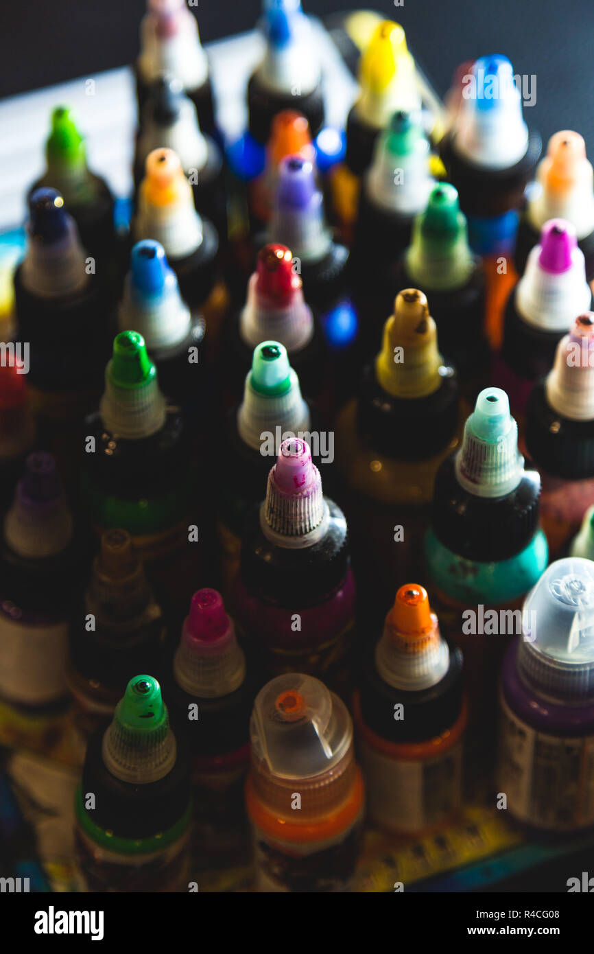 many professional bottles with colored ink for tattoos. tattoo parlor ...