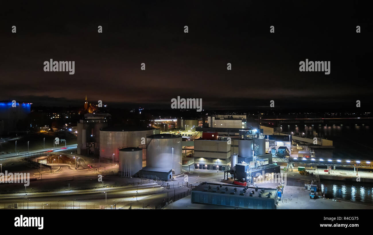 Modern grain terminal at night. Metal tanks of elevator. Grain-drying ...