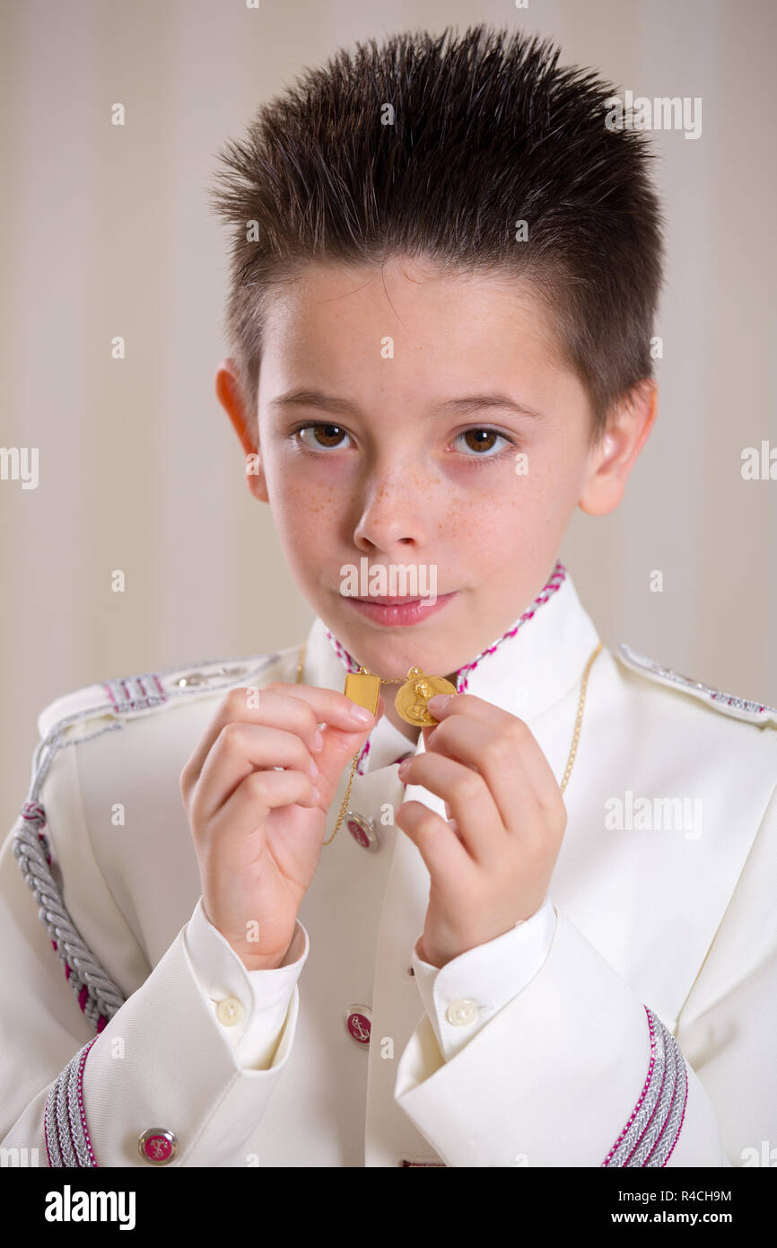 Young boy showing his medals in his First Holy Communion Stock Photo ...