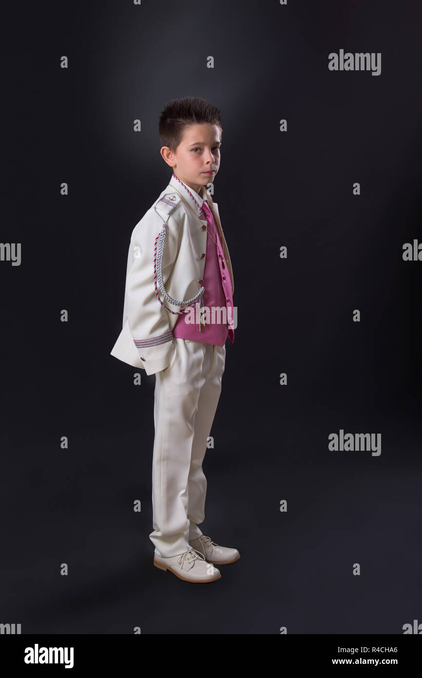 Young boy standing seriously in his First Holy Communion Stock Photo ...