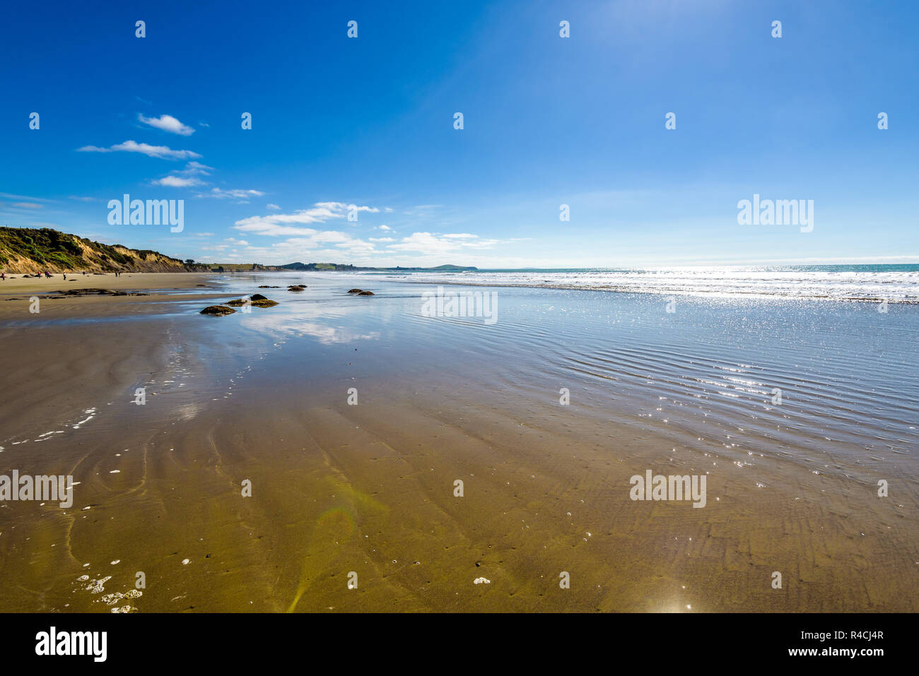 Beautiful deserted empty beach landscape with reflection of the sky on ...