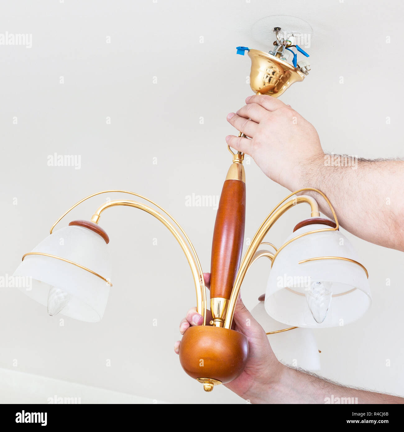 Man hanging chandelier fixture hi-res stock photography and images - Alamy