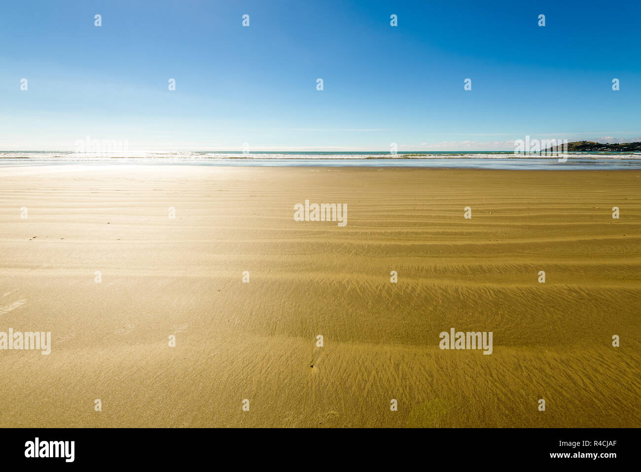 Beautiful deserted empty beach landscape with reflection of the sky on ...